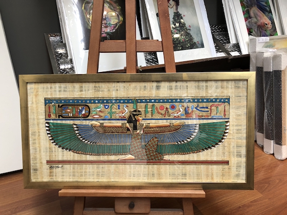 An Egyptian Papyrus Framed in a Gold Frame With Glass