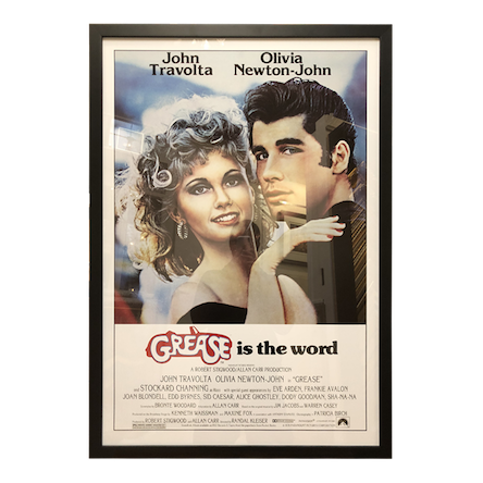 A Classic Grease Poster Framed in a Black Box Frame With Glass